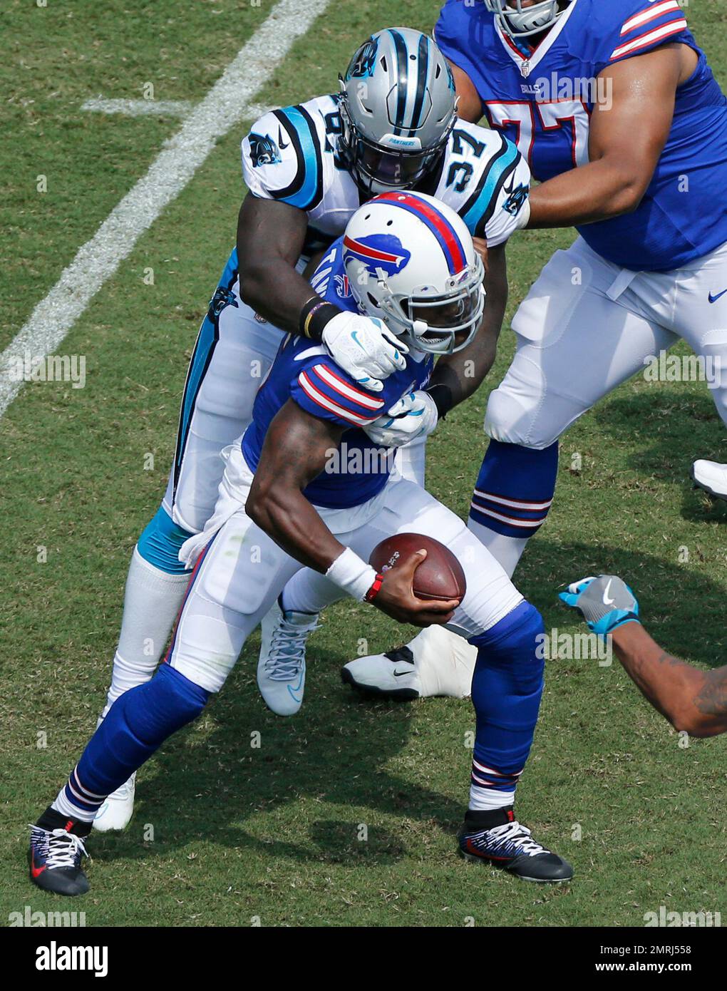 Buffalo Bills' Tyrod Taylor (5) is sacked by Carolina Panthers' Mario ...