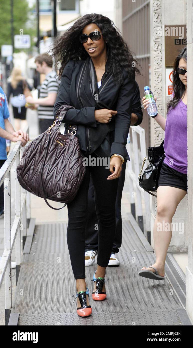 Singer Kelly Rowland leaves BBC Radio 1 clutching her oversized Miu Miu ...