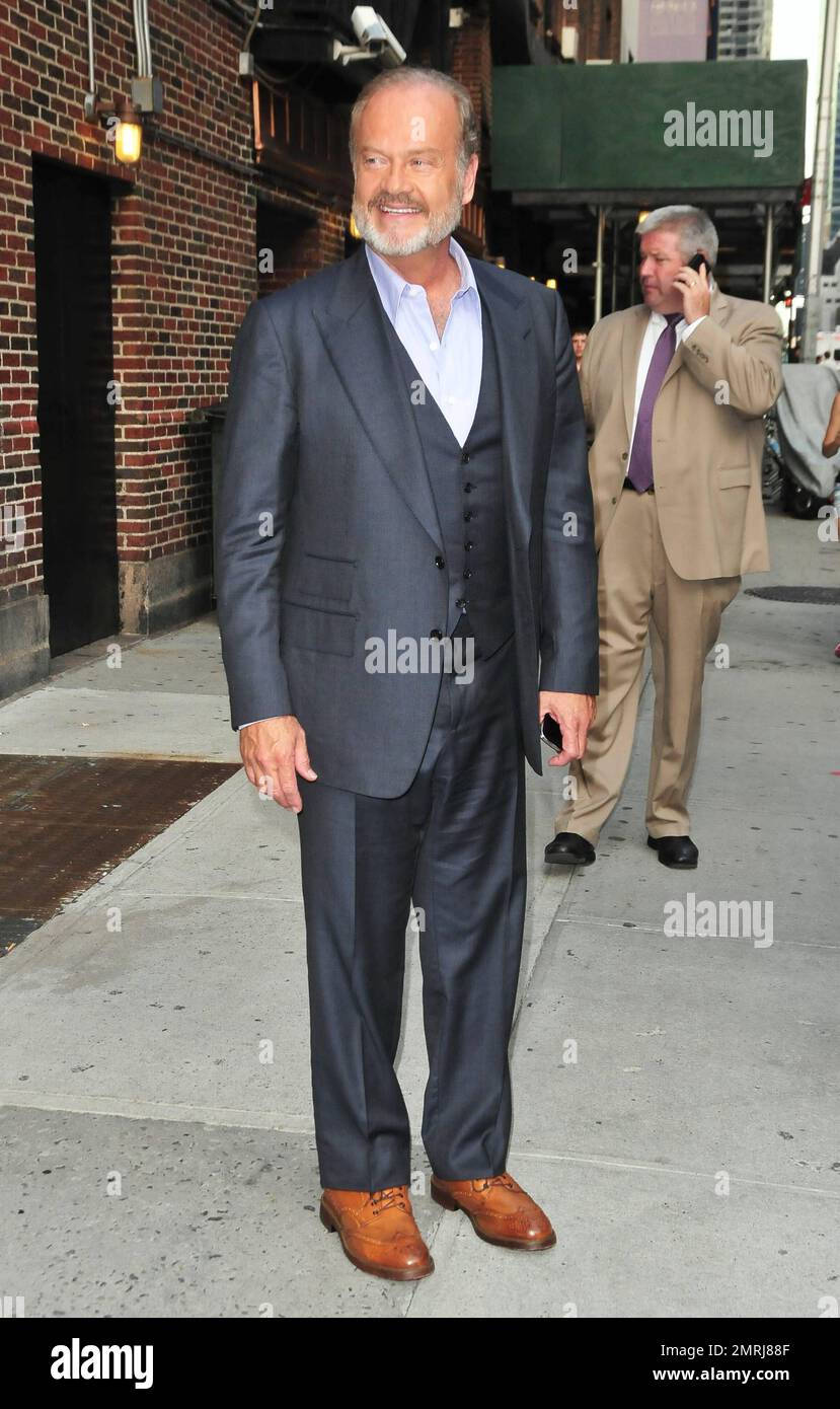 Actor Kelsey Grammer signs autographs as he arrives at the "Late Show ...