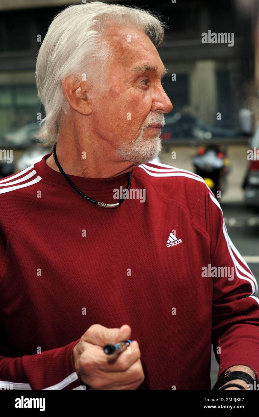Country music legend Kenny Rogers signs autographs as he leaves the BBC ...