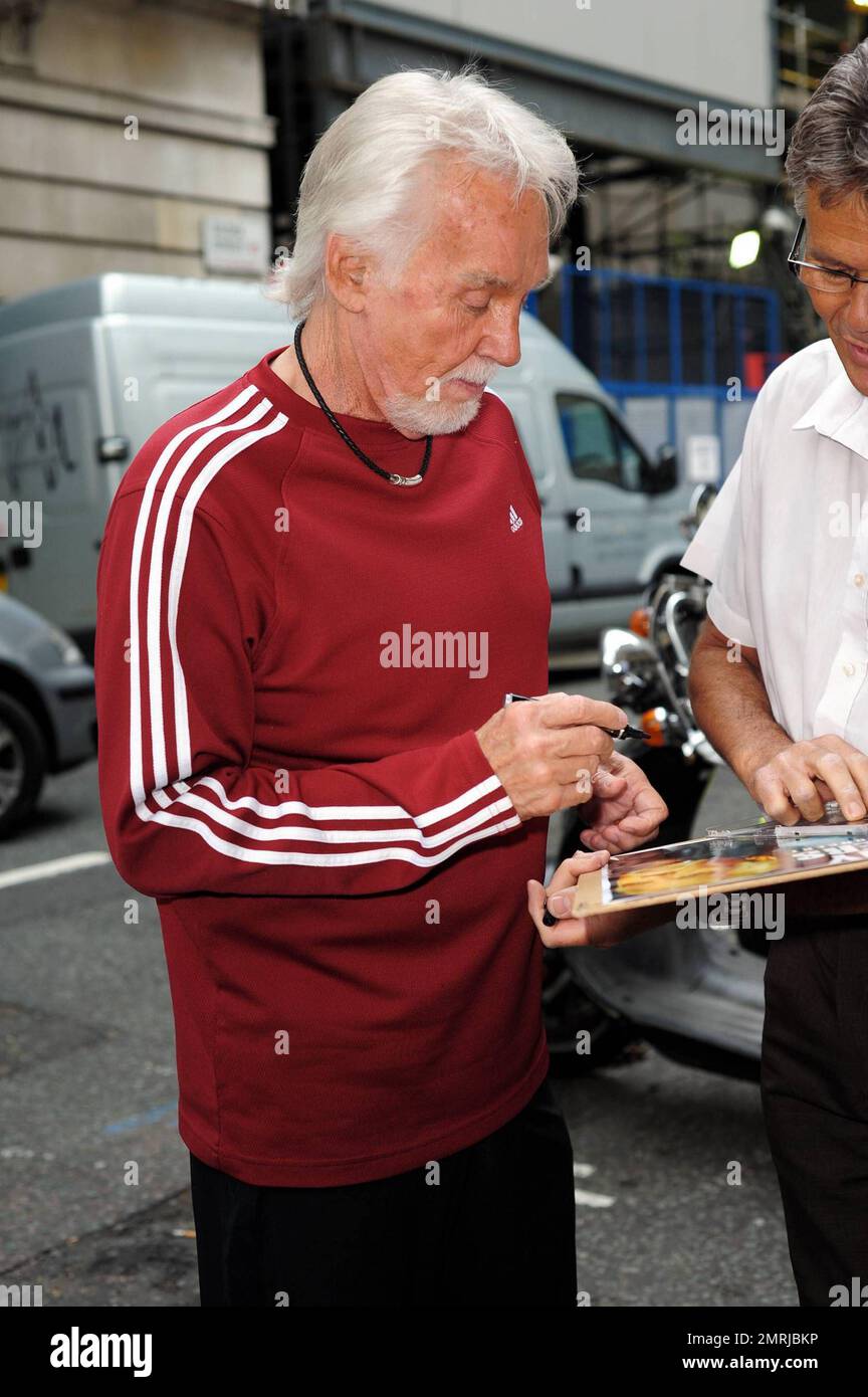 Country music legend Kenny Rogers signs autographs as he leaves the BBC ...