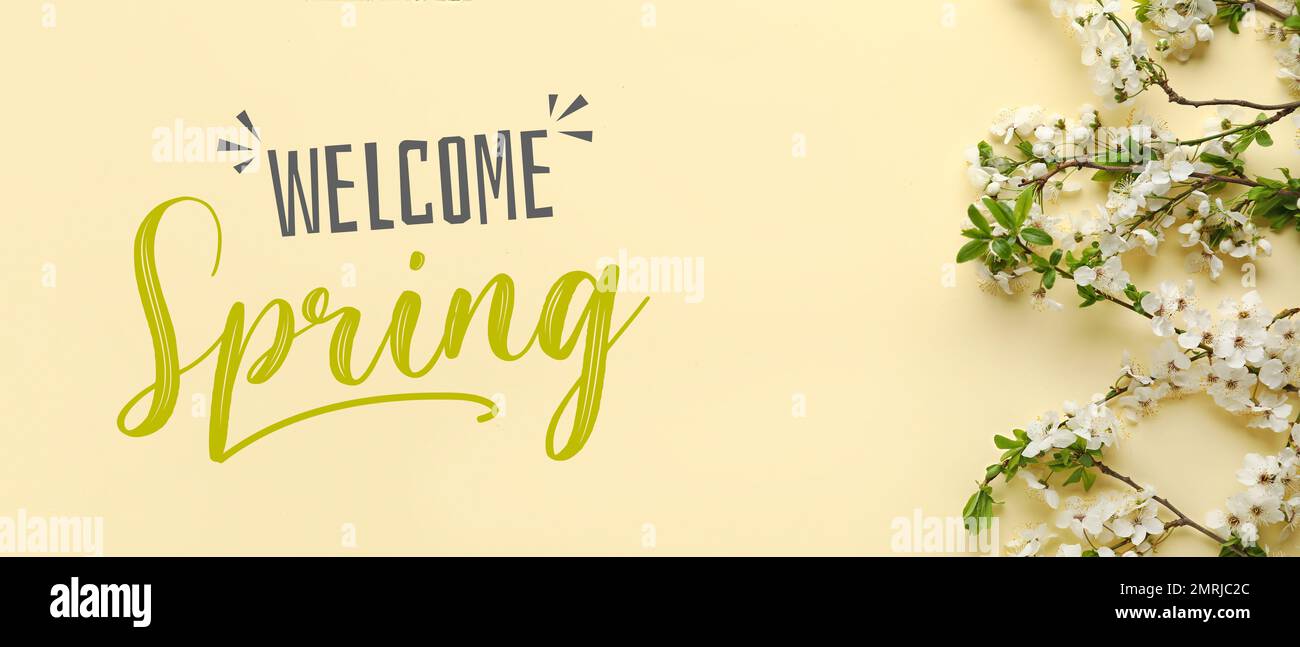 Beautiful blooming branches and text WELCOME, SPRING on beige ...