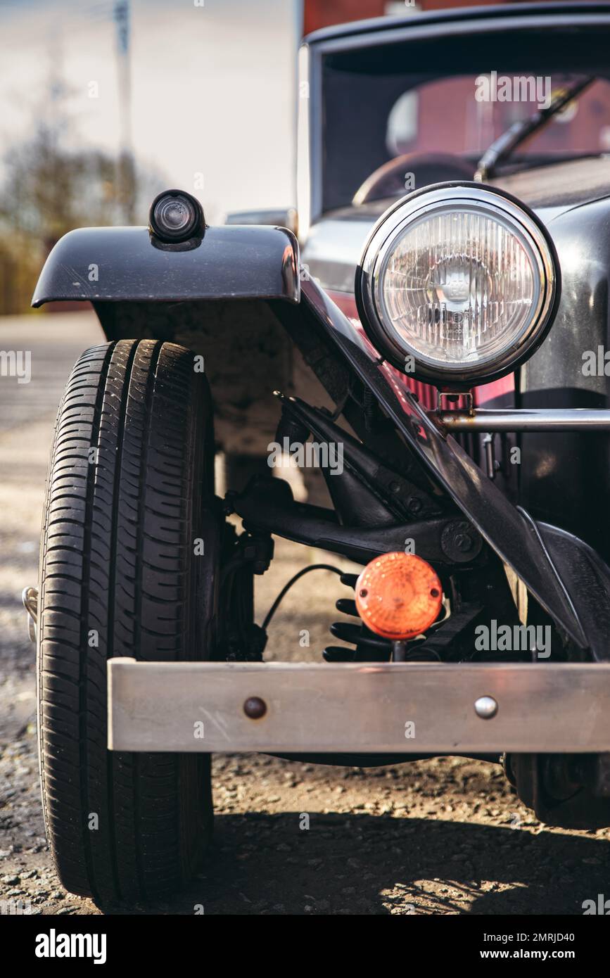 A front view of a car with light and high wheel, vertical shot Stock ...