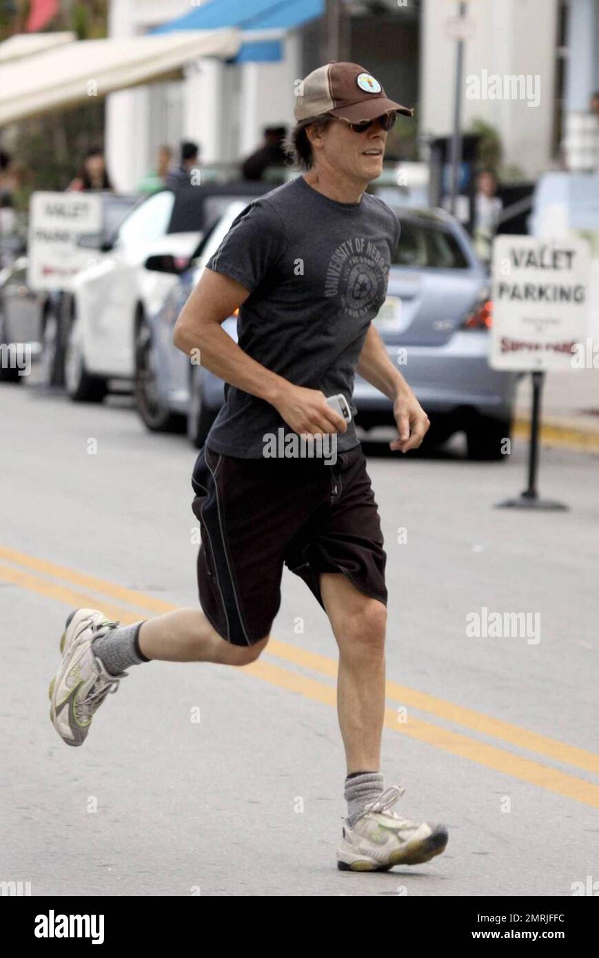 Actor Kevin Bacon gets in some jogging along the beach in Miami's ...