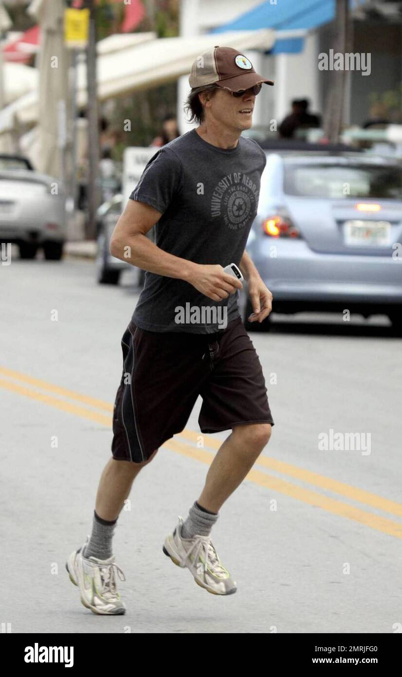 Actor Kevin Bacon gets in some jogging along the beach in Miami's ...