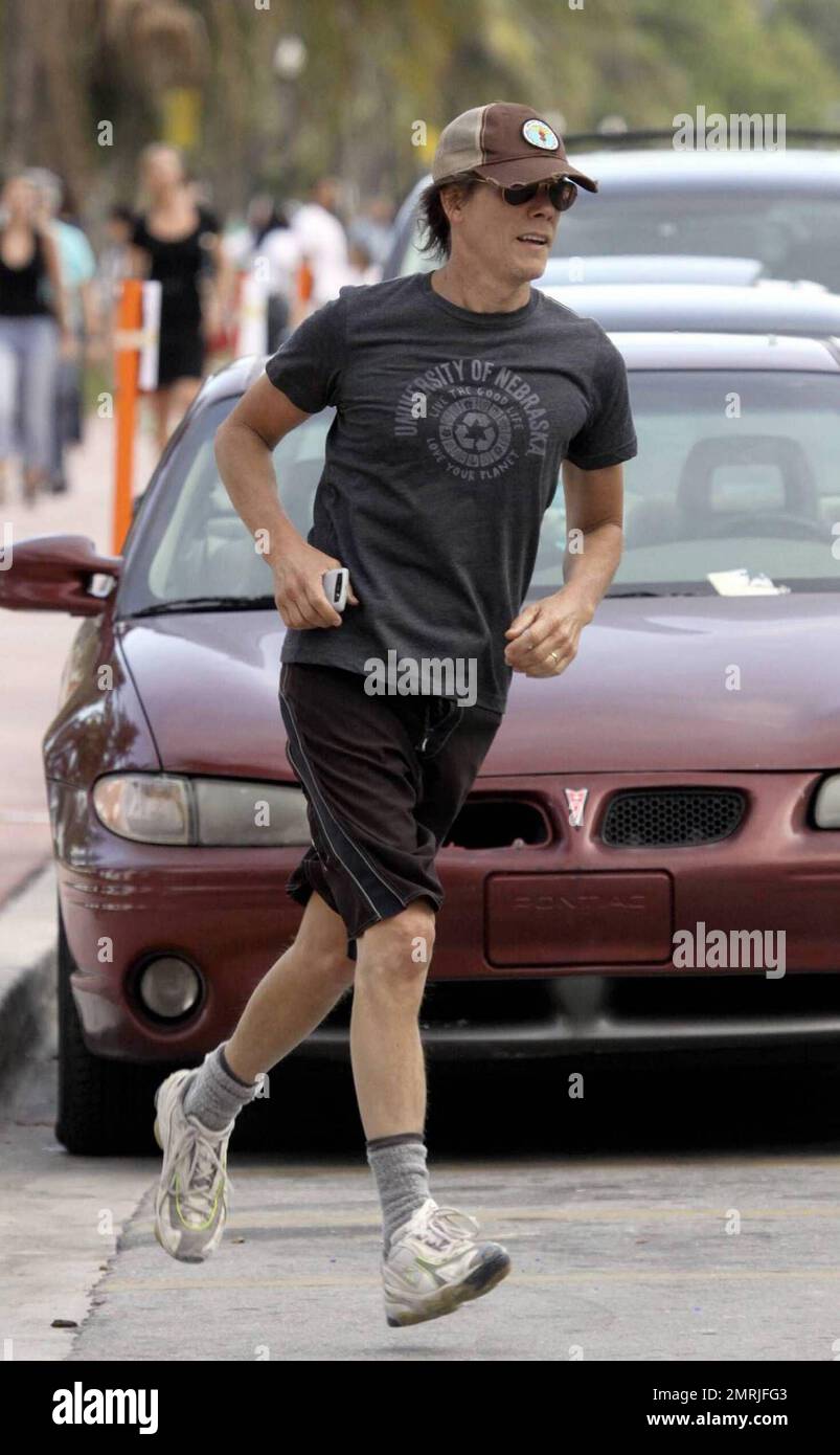 Actor Kevin Bacon gets in some jogging along the beach in Miami's ...