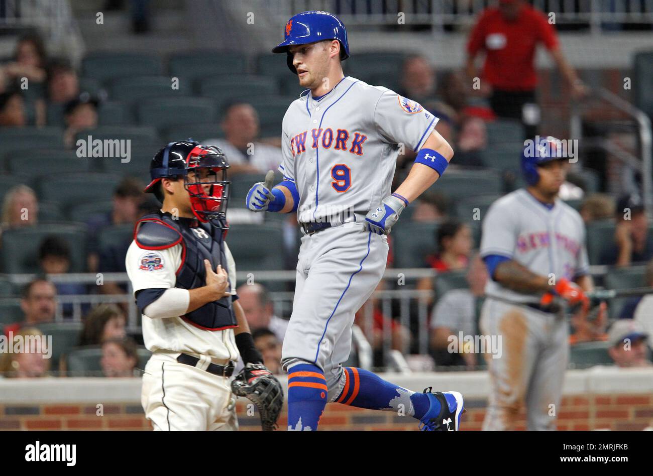 New York Mets' Brandon Nimmo (9) scores past Atlanta Braves catcher ...