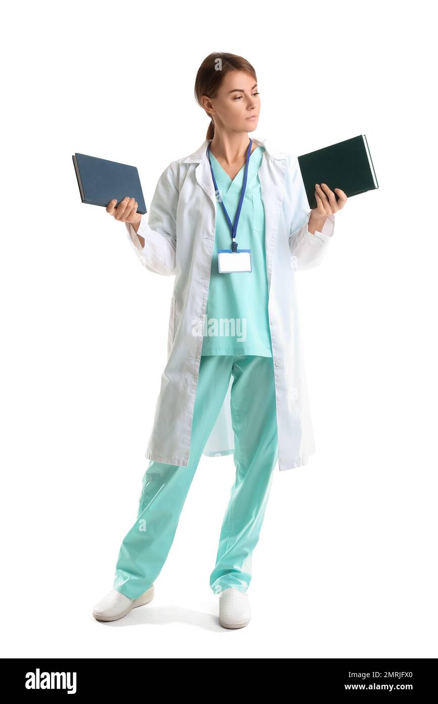 Female doctor with books on white background Stock Photo - Alamy
