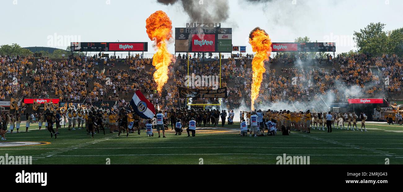 The Missouri football team runs on the field before the start of an ...