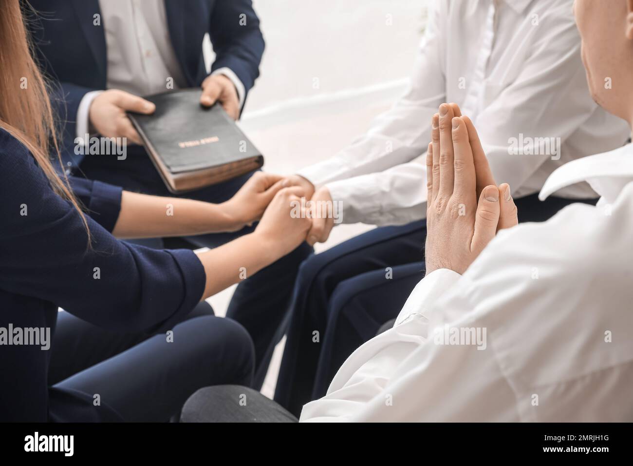 Group business people praying together hi-res stock photography and ...