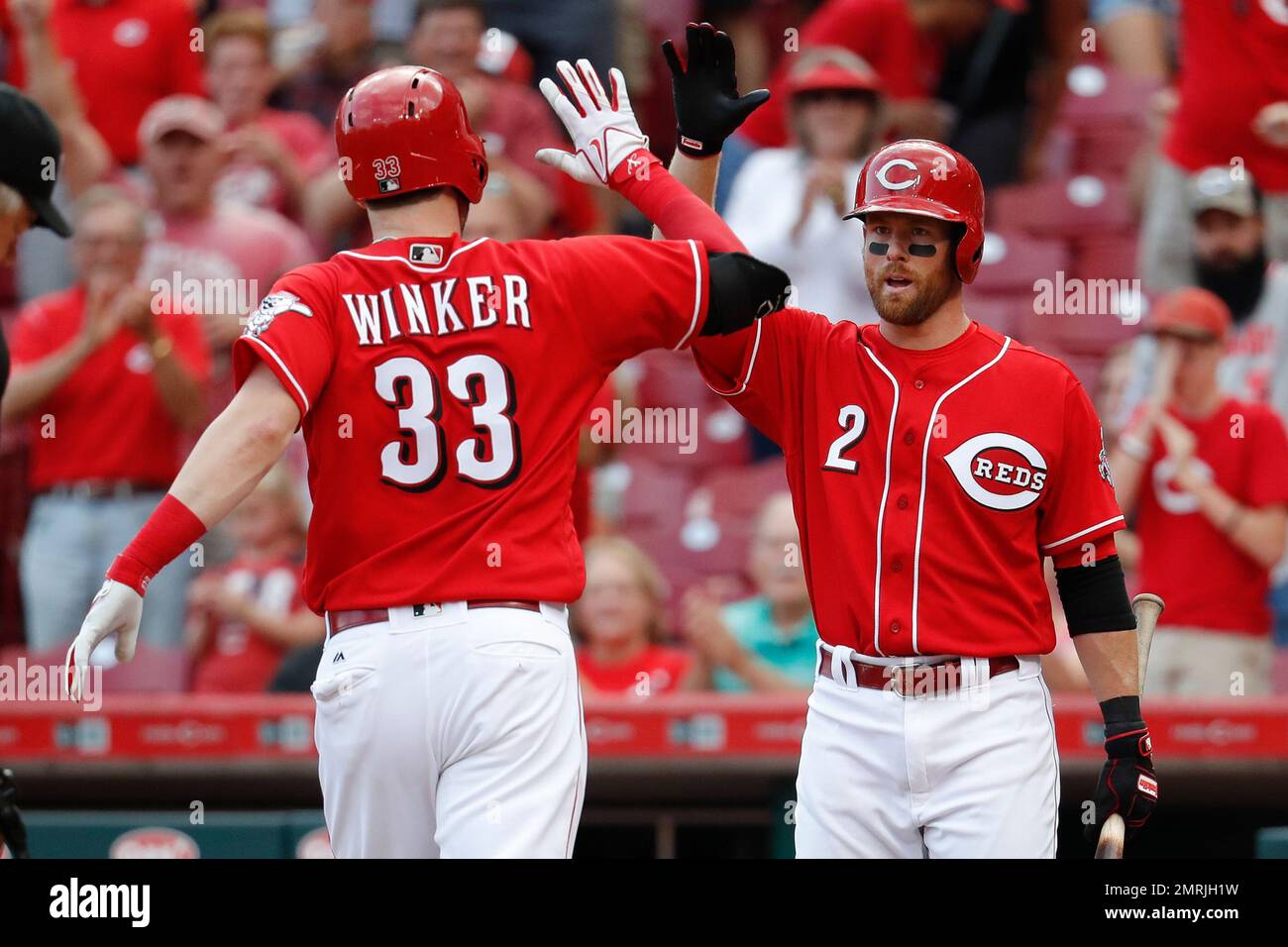 Cincinnati Reds' Jesse Winker (33) celebrates with Zack Cozart (2 ...