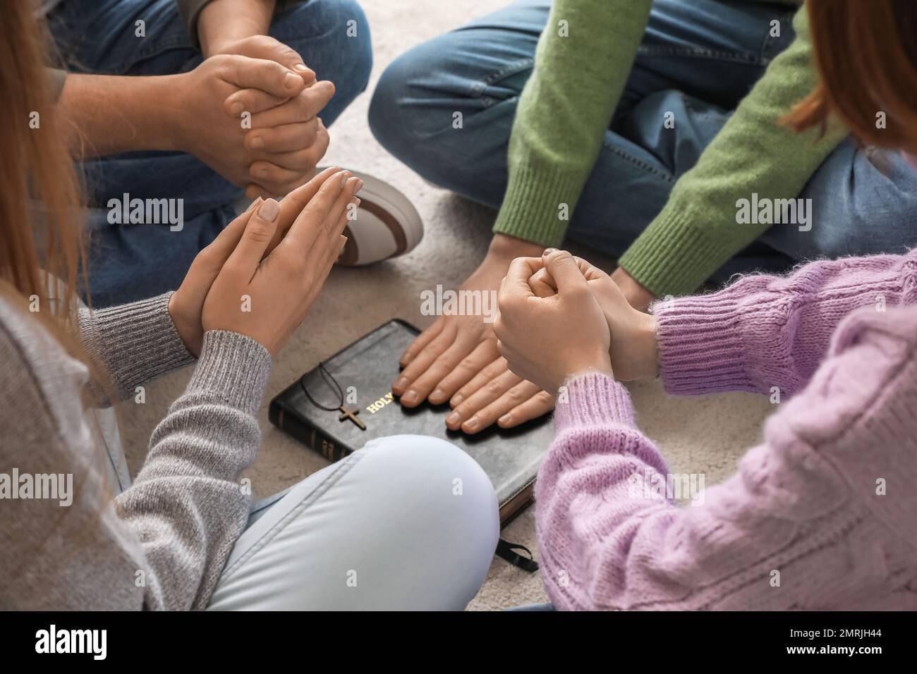 Group of people praying with Holy Bible at home, closeup Stock Photo ...