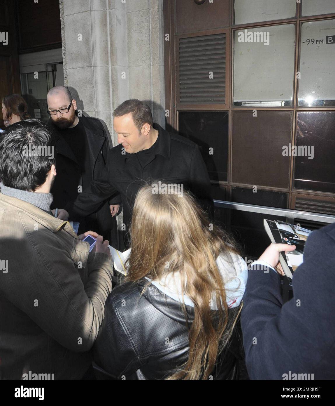 Actor Kevin James signs autographs for fans as he leaves the studios of ...