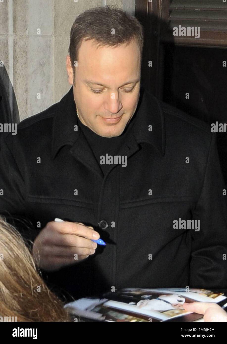 Actor Kevin James signs autographs for fans as he leaves the studios of ...