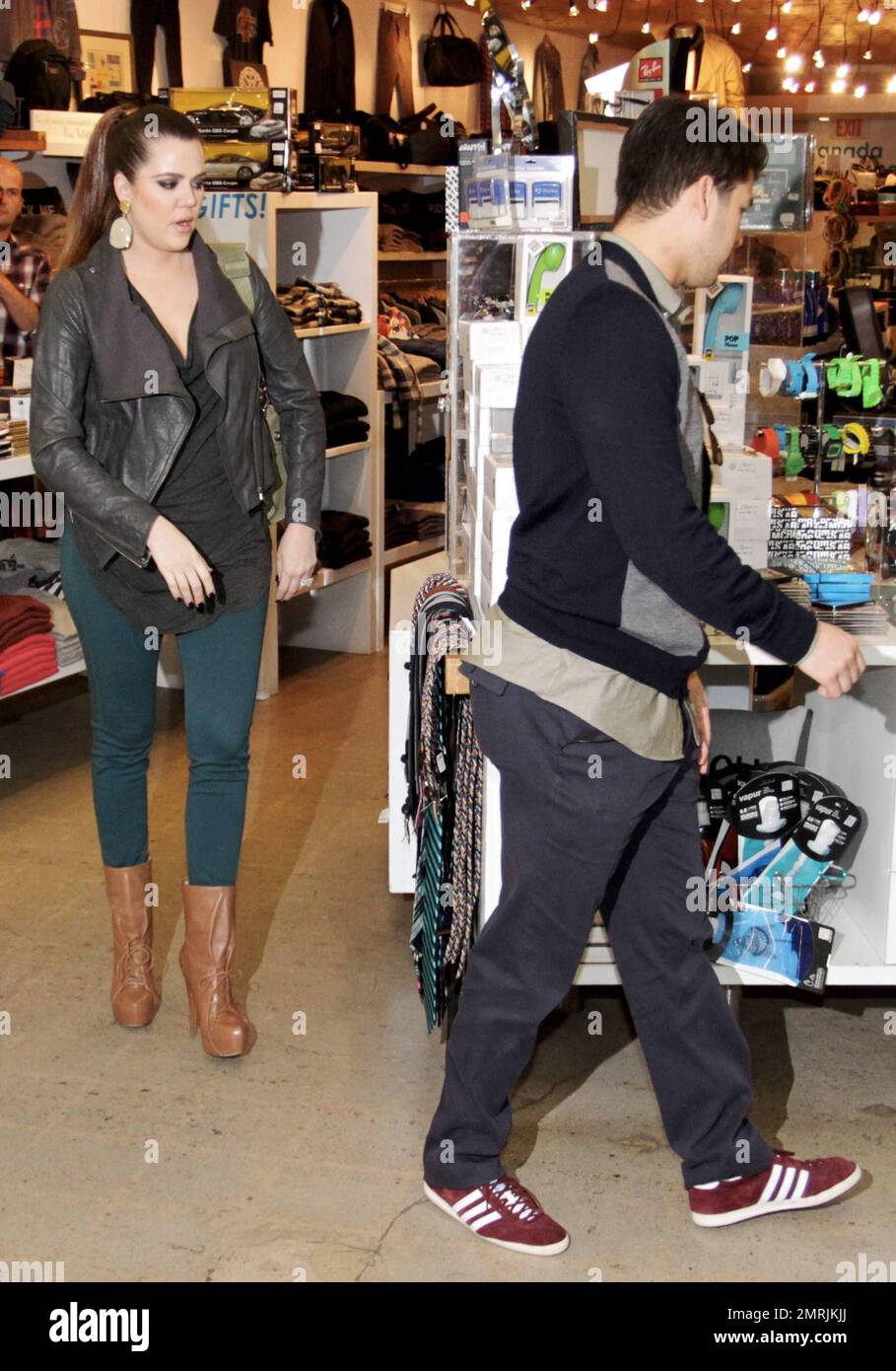 Khloe Kardashian with her husband Lamar Odom and her brother Rob ...