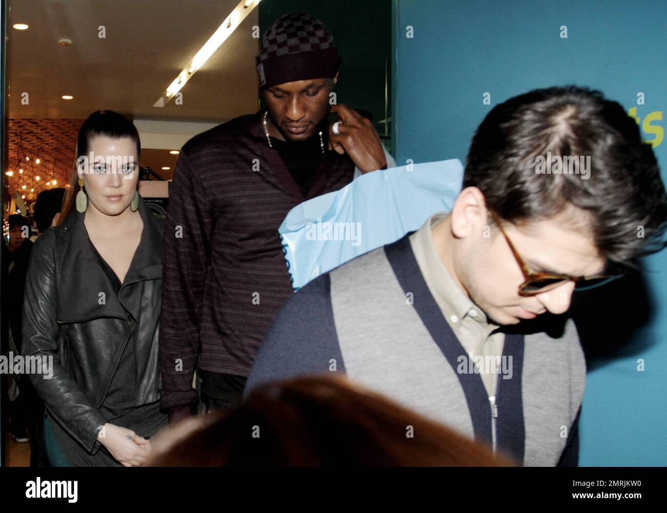 Khloe Kardashian with her husband Lamar Odom and her brother Rob ...