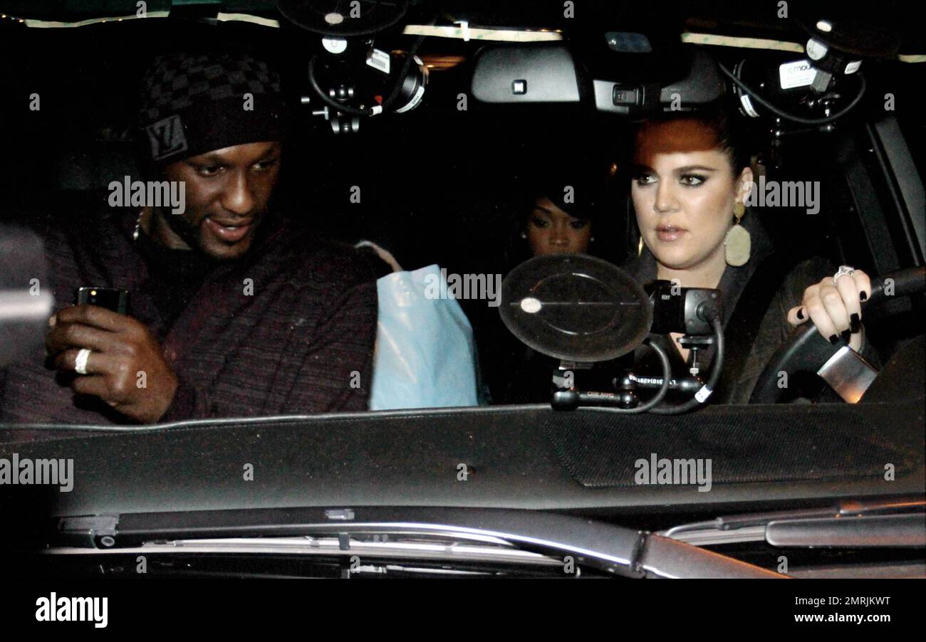 Khloe Kardashian with her husband Lamar Odom and her brother Rob ...