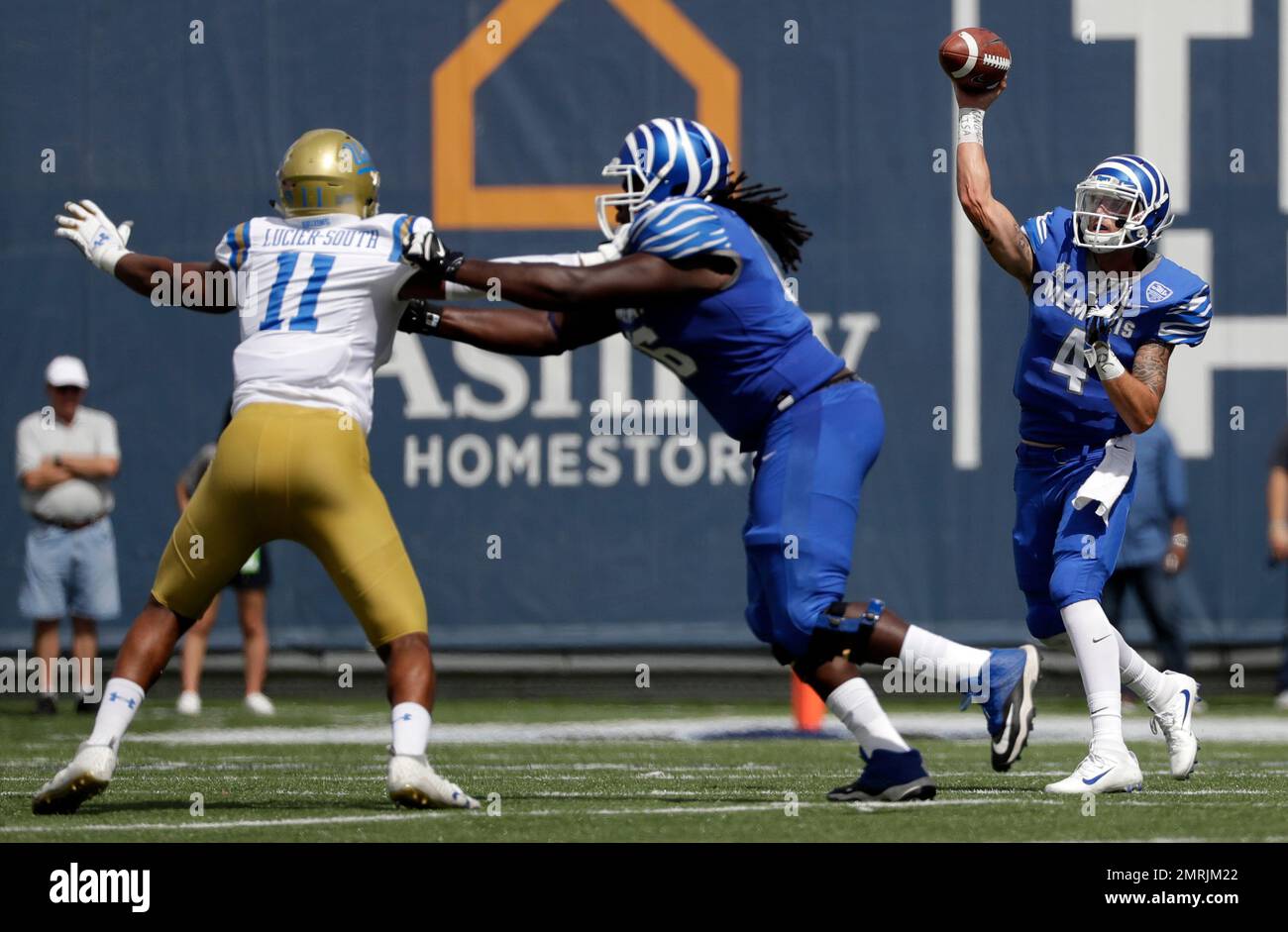 Memphis quarterback Riley Ferguson (4) passes over UCLA defensive ...