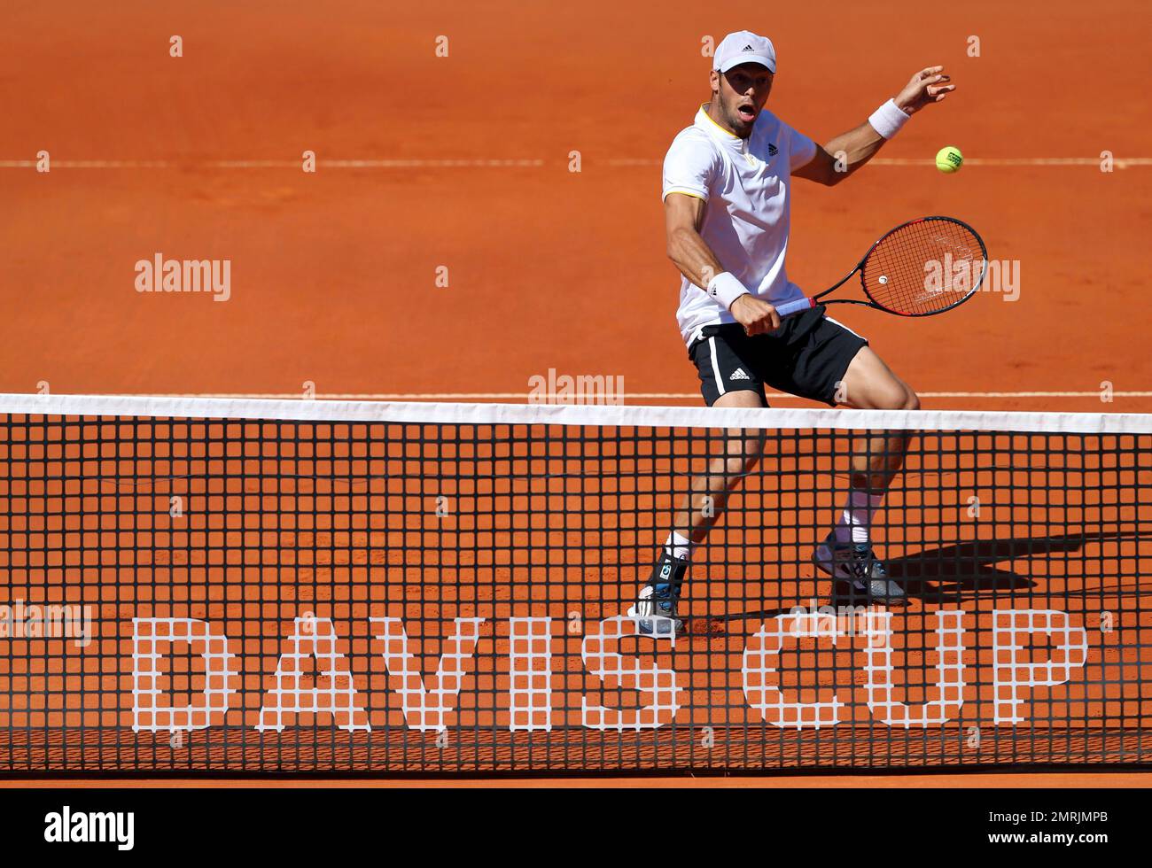 Germany's Tim Puetz returns the ball to Portugal's Joao Sousa and ...
