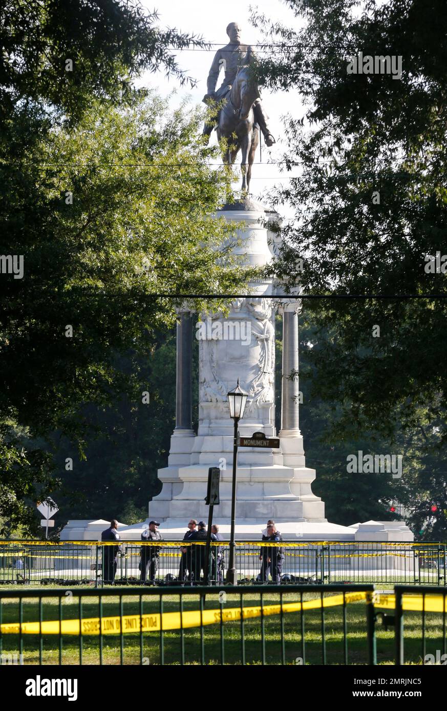 State and city police surround the statue of Confederate General Robert ...