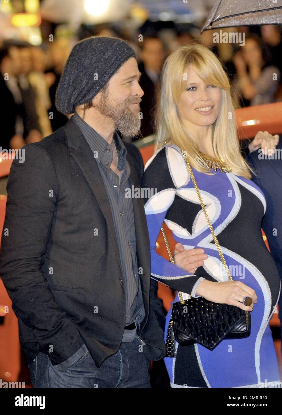 Brad Pitt poses with the very pregnant Claudia Schiffer at the premiere ...