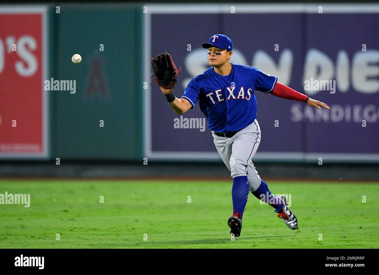 Texas Rangers right fielder Shin-Soo Choo fields a ball hit for an RBI ...