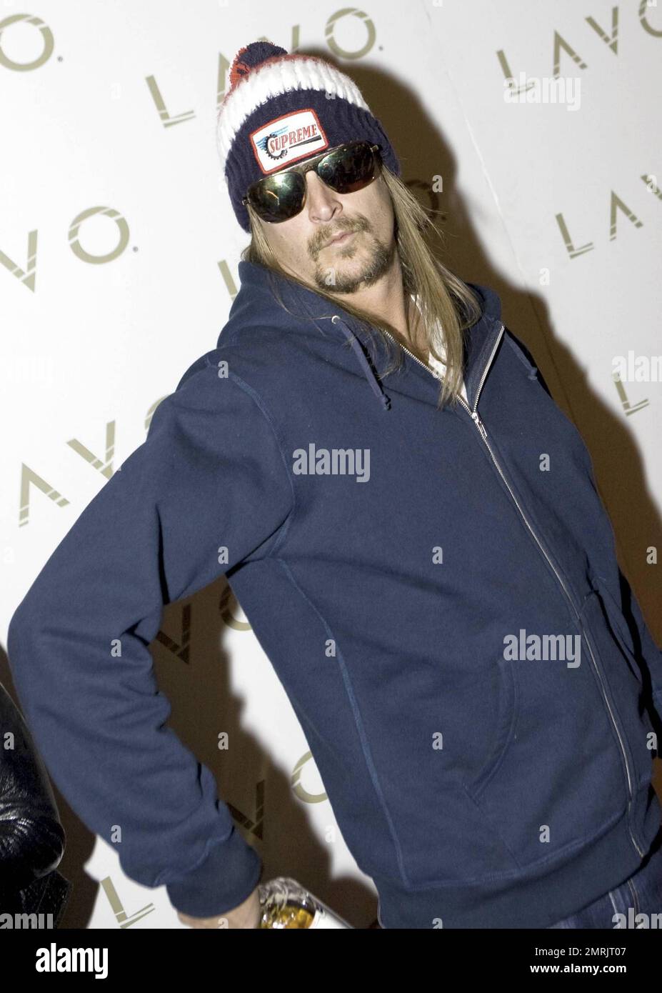 Rocker Kid Rock brings a long a cigar and a bottle of Jack Daniels as ...
