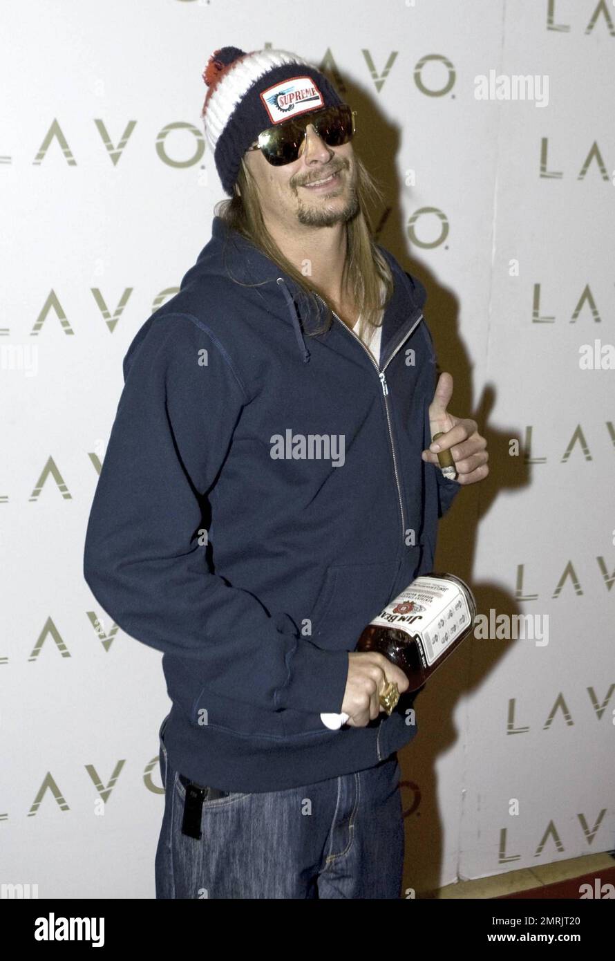 Rocker Kid Rock brings a long a cigar and a bottle of Jack Daniels as ...