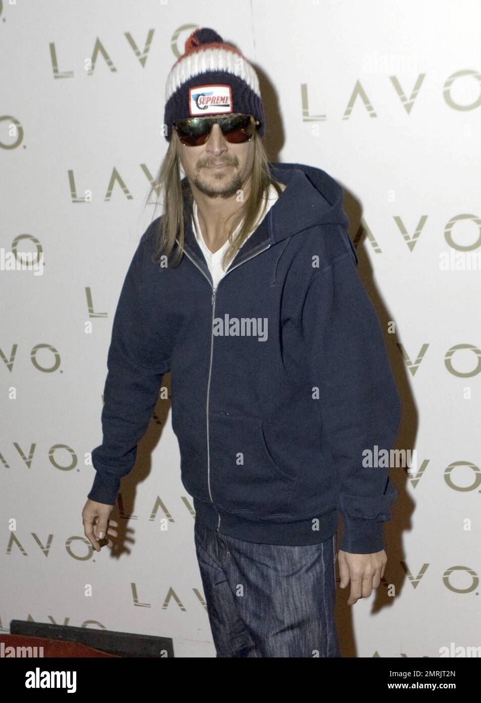 Rocker Kid Rock brings a long a cigar and a bottle of Jack Daniels as ...