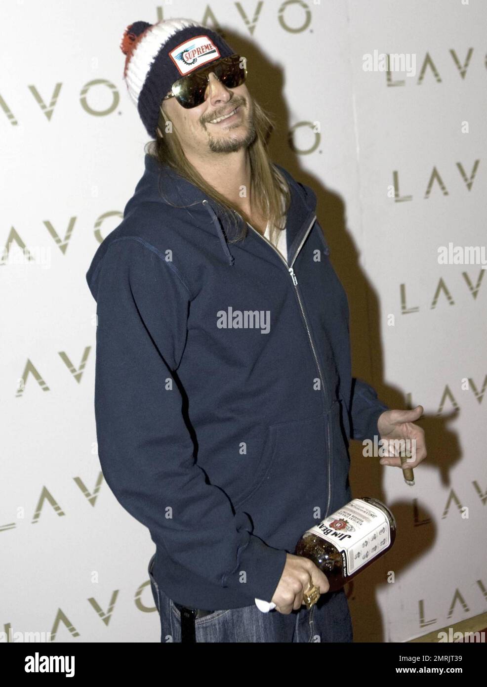 Rocker Kid Rock brings a long a cigar and a bottle of Jack Daniels as ...