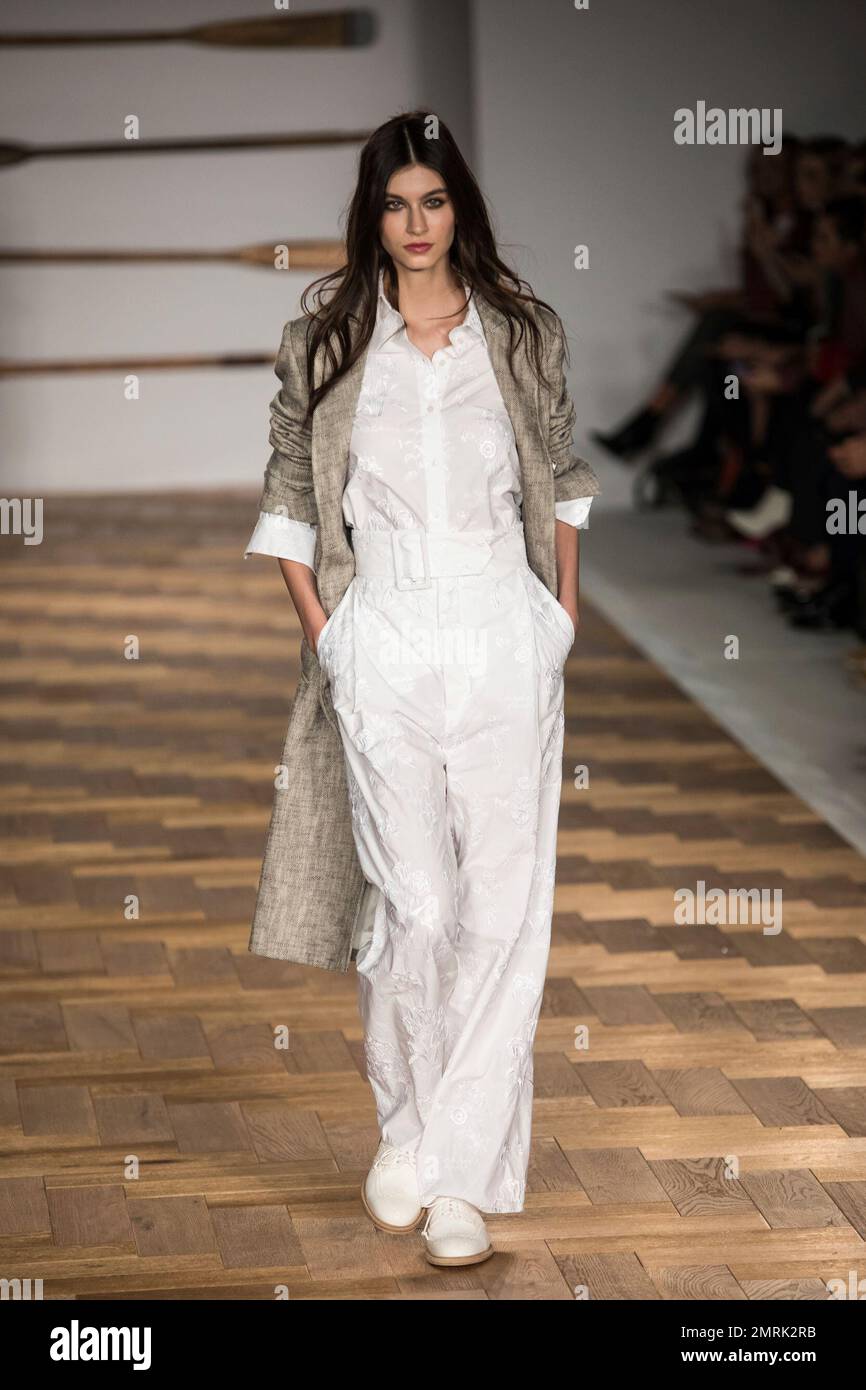 A model wears a creation by designer DAKS during their Spring/Summer ...