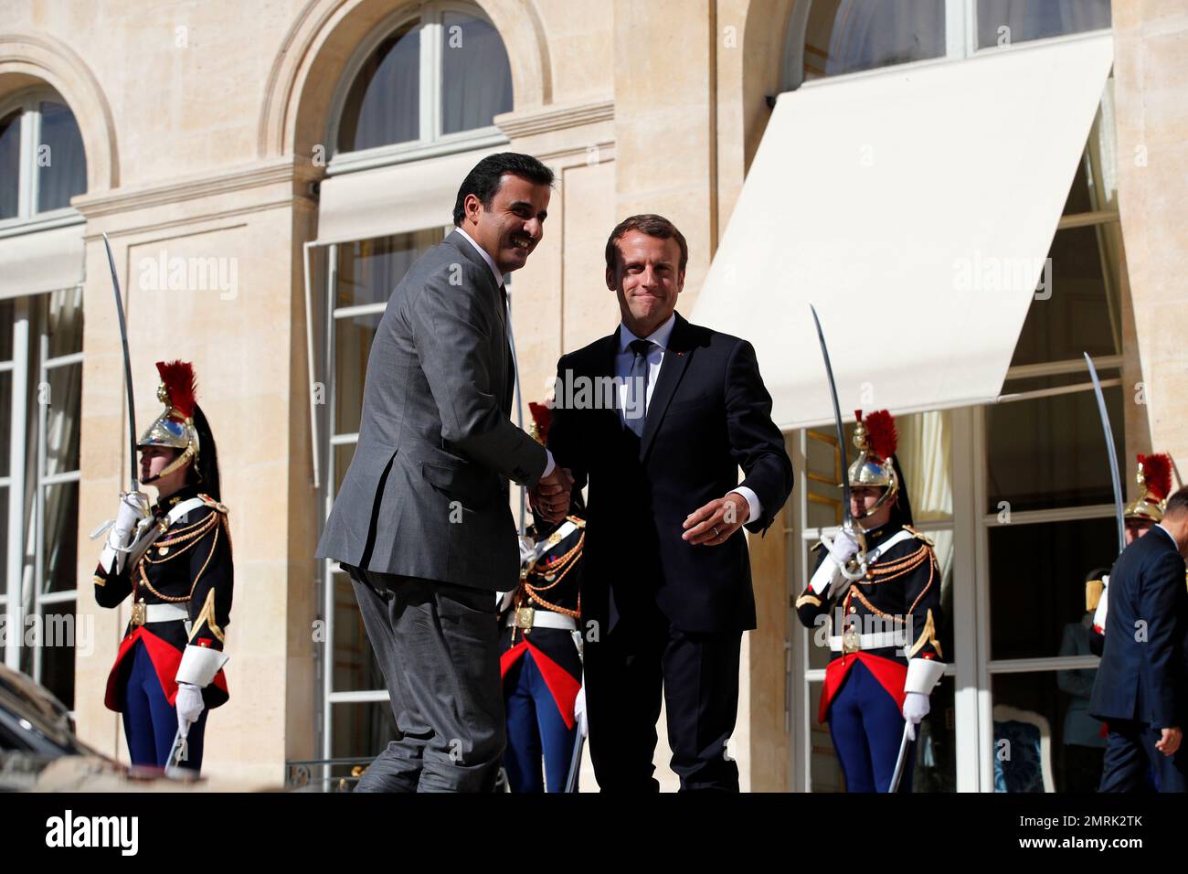 France's President Emmanuel Macron greets the Emir of Qatar, Sheikh ...