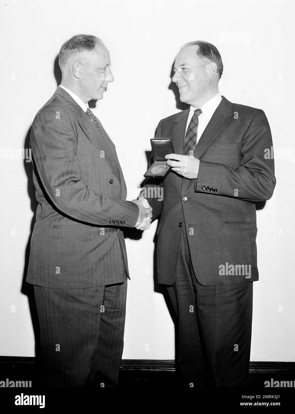 Wallace B. Grange, left, of Babcock, Wisc., is congratulated by Richard ...