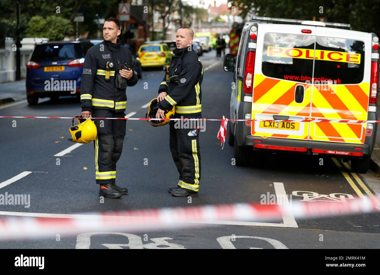 Fire Brigade officers stand inside a cordon near where an incident ...