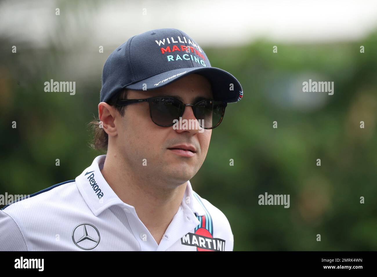 Williams driver Felipe Massa of Brazil arrives at the Marina Bay City ...