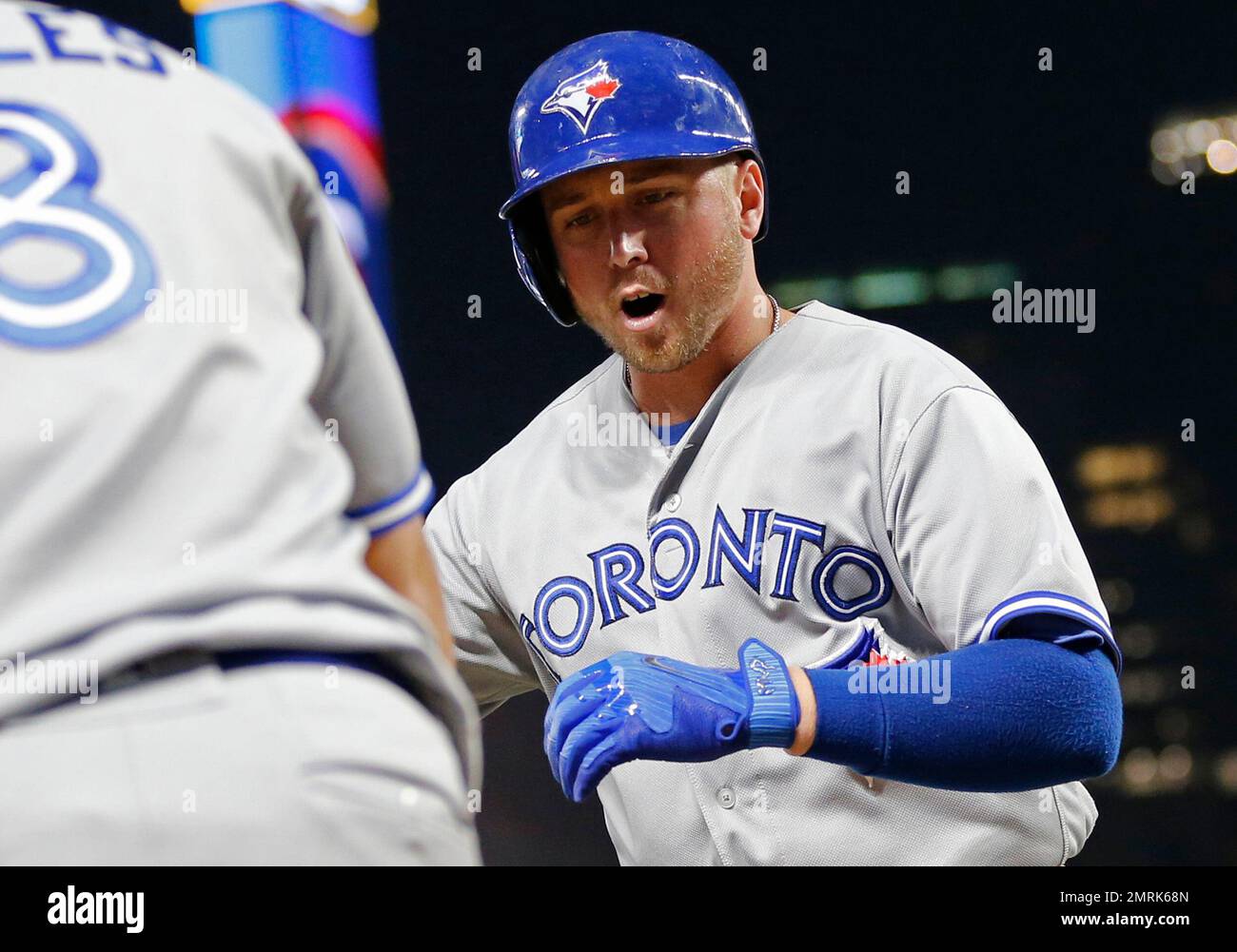Toronto Blue Jays' Justin Smoak, right, celebrates his game-tying home ...