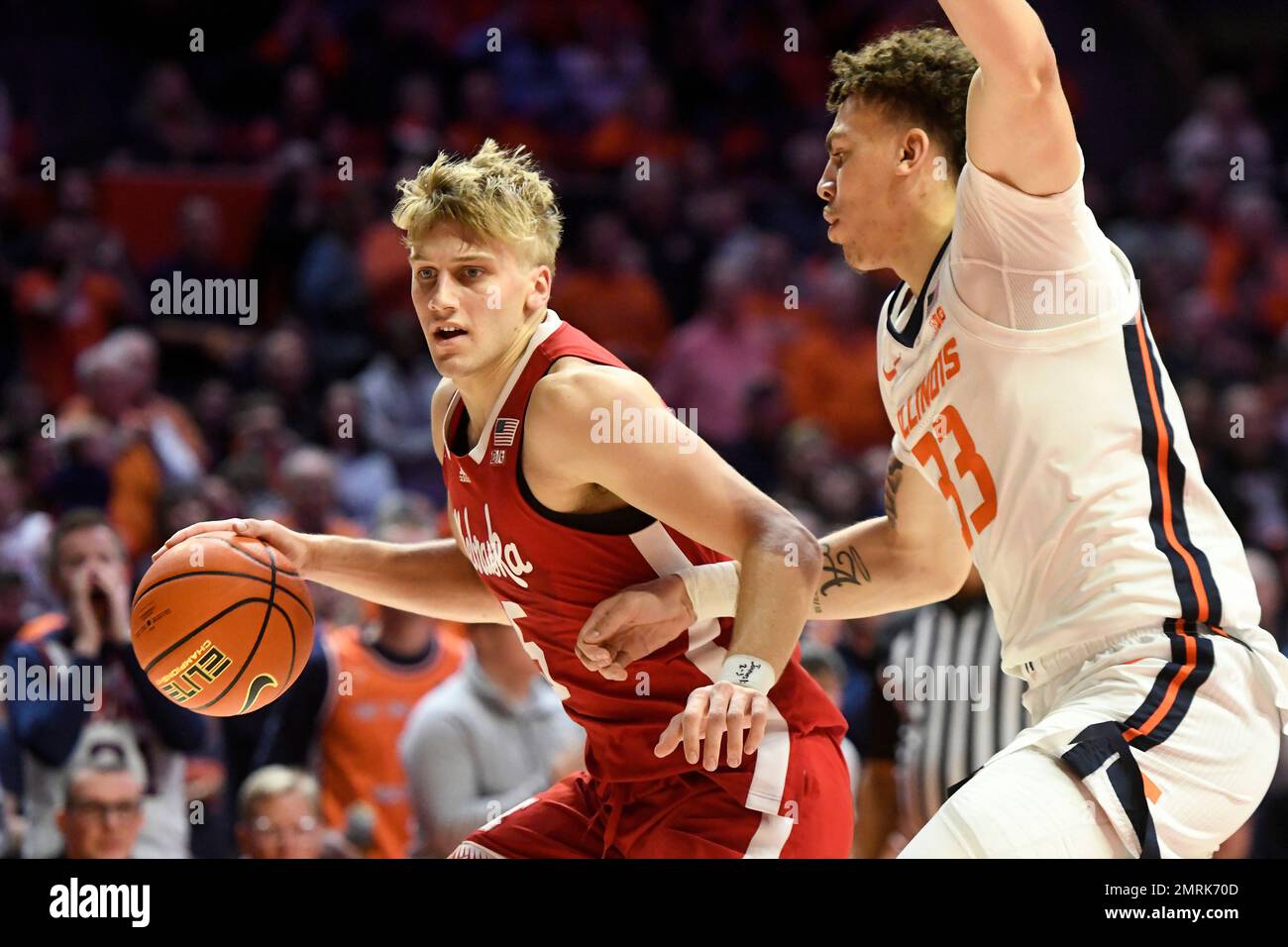 Nebraska's Sam Griesel, left, dribbles as Illinois' Coleman Hawkins (33 ...