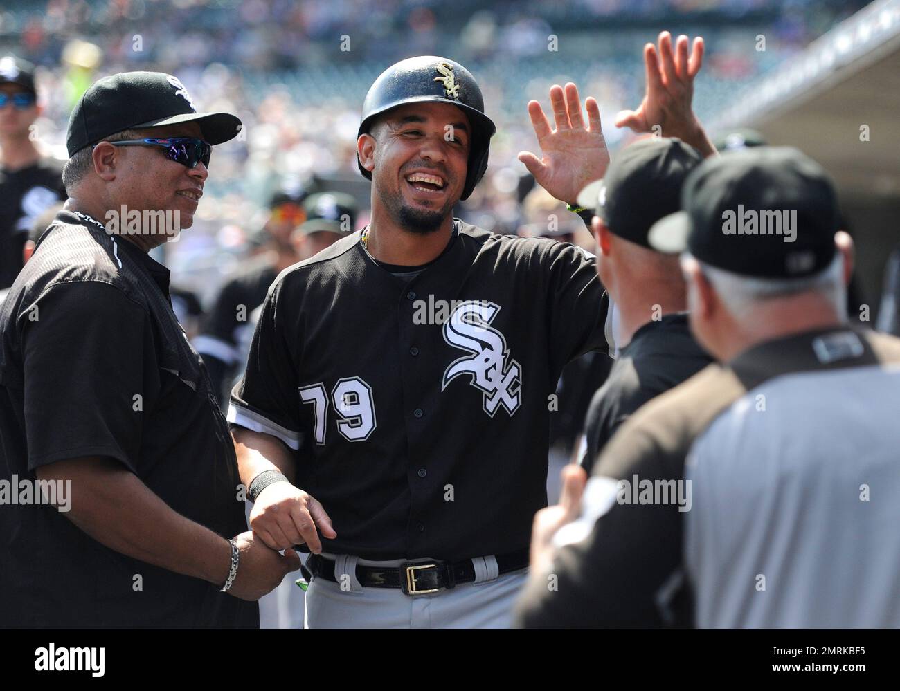 Chicago White Sox first baseman Jose Abreu (79) is congratulated in the ...