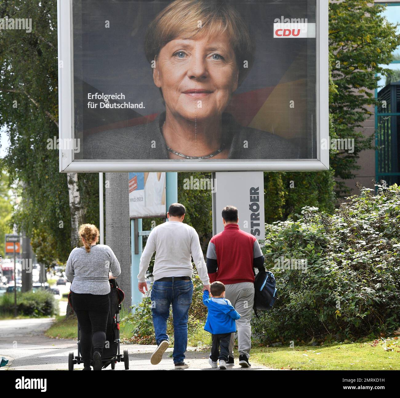 A poster of German Chancellor Angela Merkel for the upcoming general ...