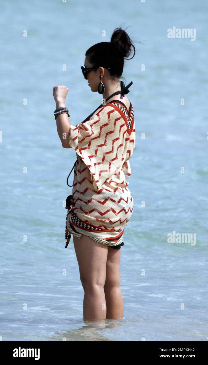 A busty Kim Kardashian goes for a paddle with pals at her luxury Miami ...