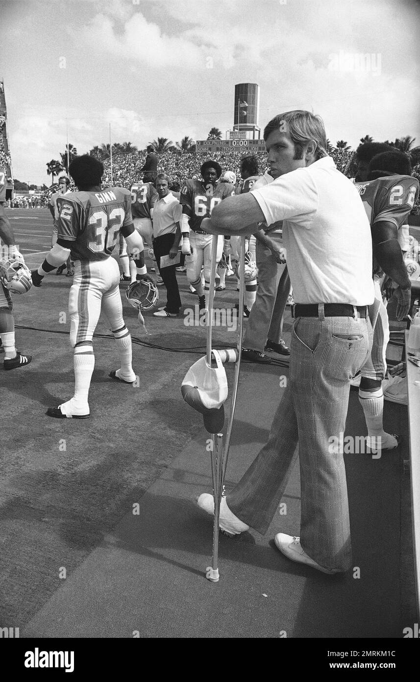 Miami star quarterback Bob Griese wears a forlorn look as he leans on ...