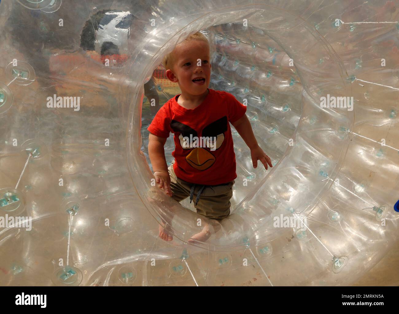 Winner of a Mr. Dwarf competition, Adriaan Coetzee, plays in a plastic ...