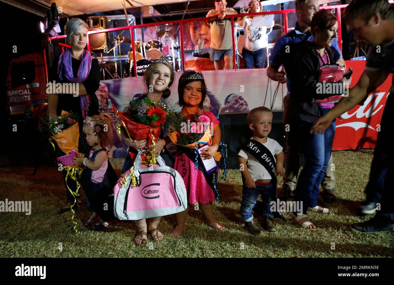Winners of a Mr. and Ms. Dwarf competition, Adriaan Coetzee, right ...