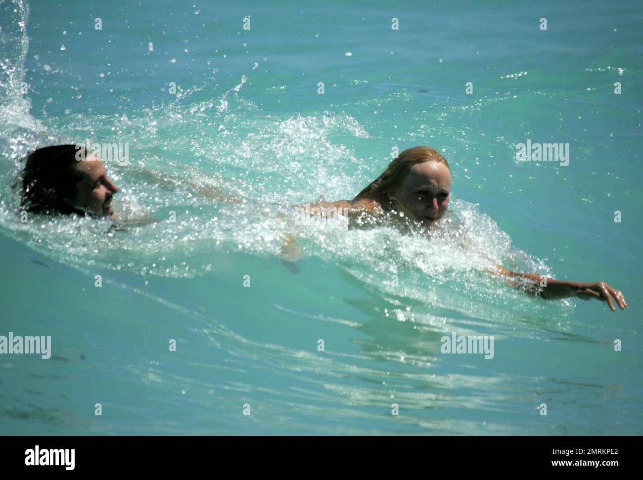 Exclusive!! Kim Stewart and fiancee Cisco Adler fool around in the surf ...
