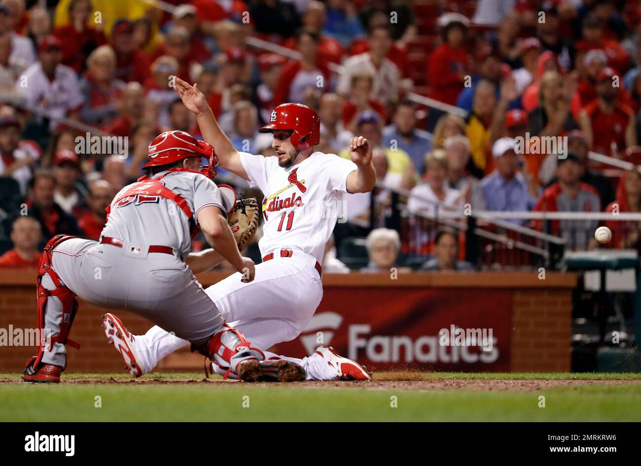 St. Louis Cardinals' Paul DeJong (11) is safe as Cincinnati Reds ...