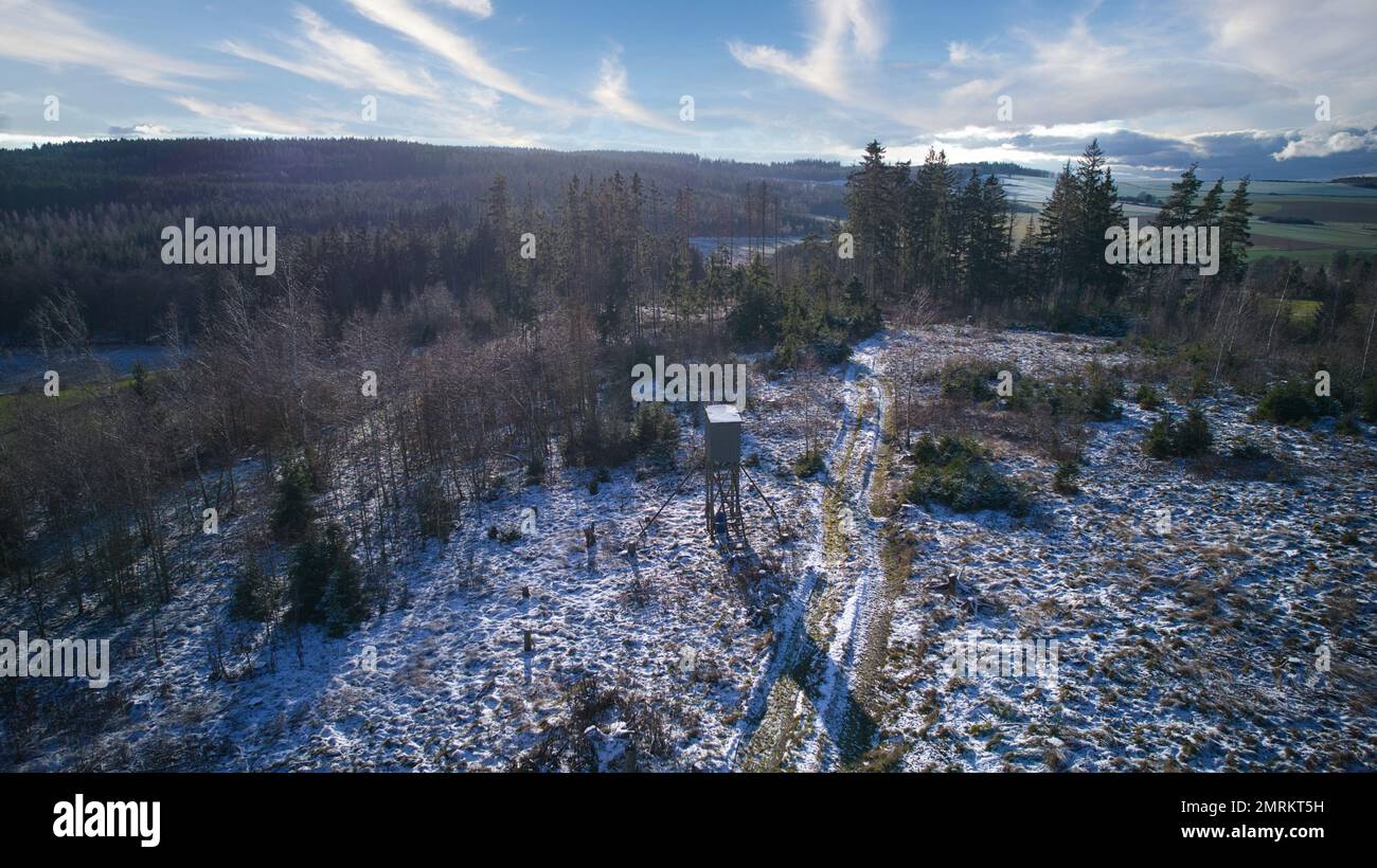 A bird's-eye view of a dirt road on a hill covered in snow Stock Photo ...