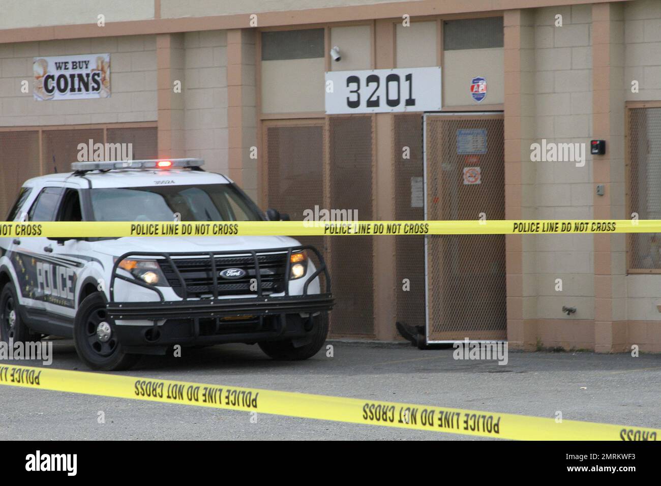 The legs of one shooting victim are shown sticking out from a precious ...