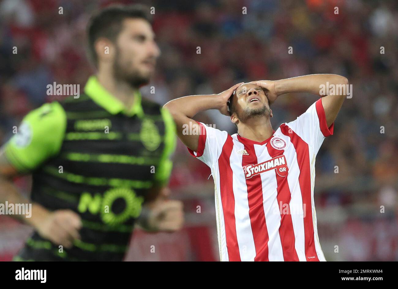 Olympiakos's Vadis Odjidja-Ofoe, right, reacts after missing a scoring ...