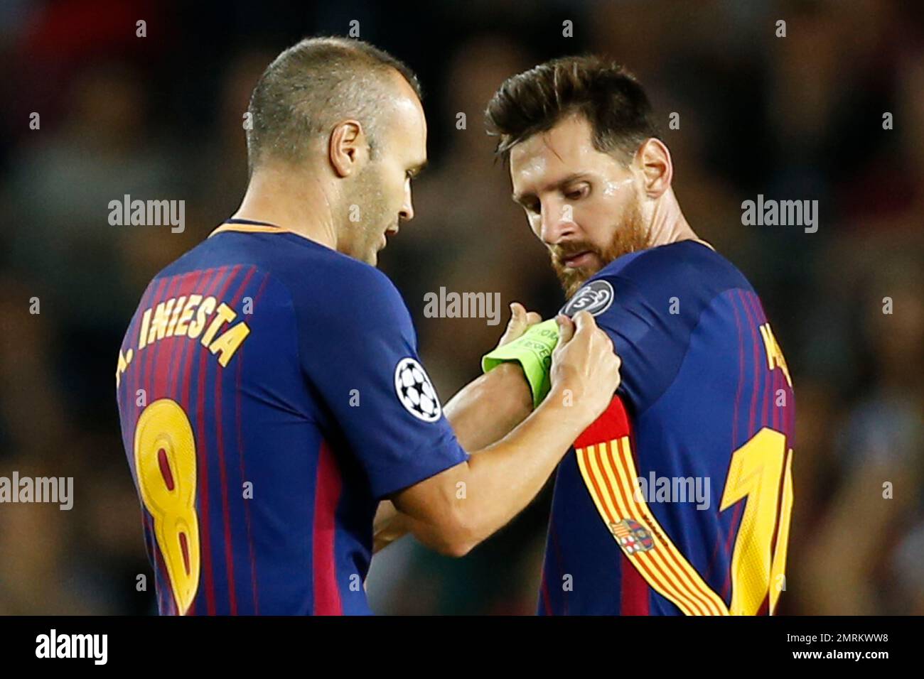 Barcelona's Andres Iniesta hands over the captain's armband to Lionel ...
