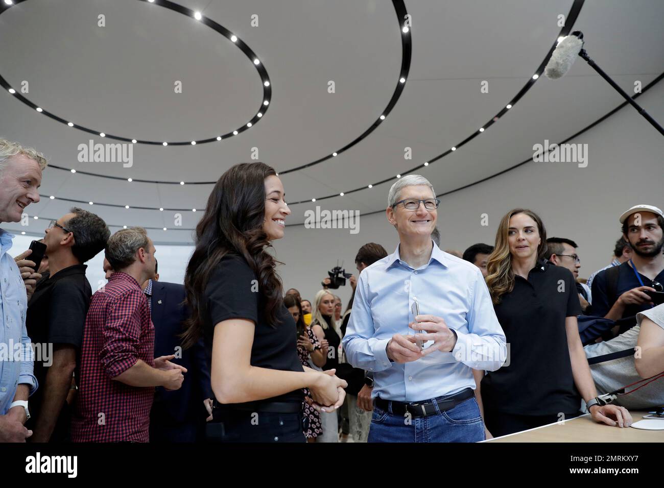 Apple CEO Tim Cook shows the new iPhone X in the showroom after the new ...